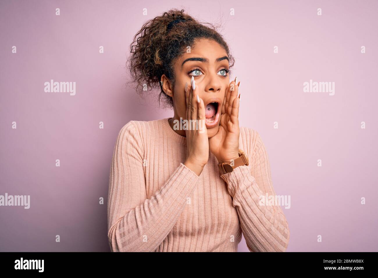 Young beautiful african american girl wearing casual sweater standing ...