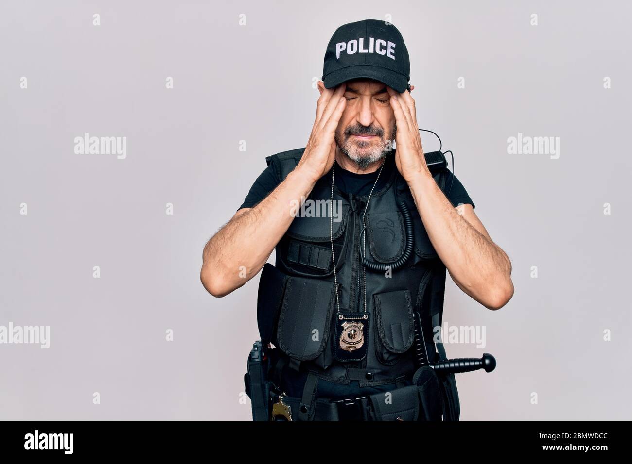 Middle age policeman wearing police uniform and bulletproof vest over ...