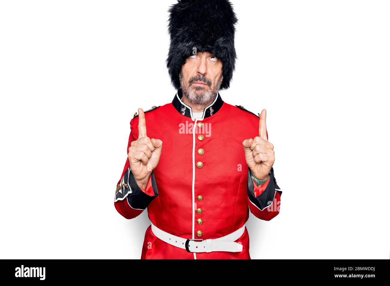Middle age handsome wales guard man wearing traditional uniform over ...