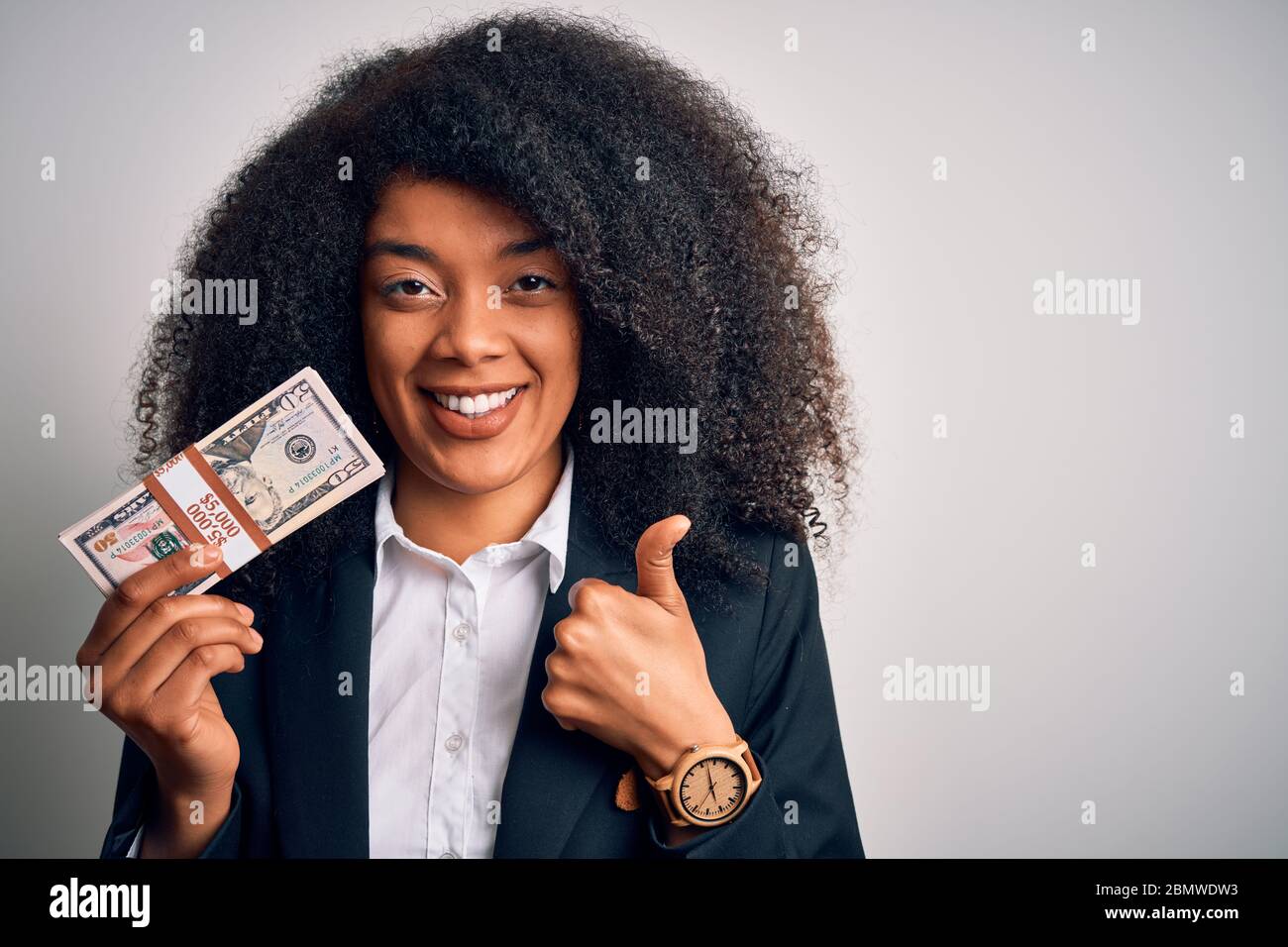 Young african american business woman with afro hair holding a bunch of ...