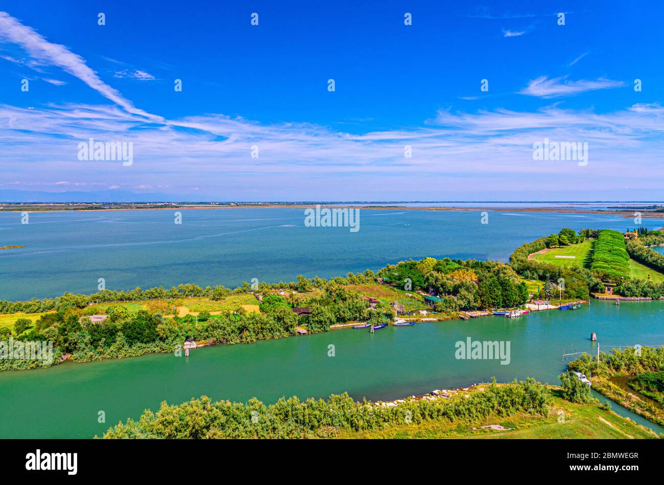 Aerial view of Torcello islands, water canal with fishing boats and ...