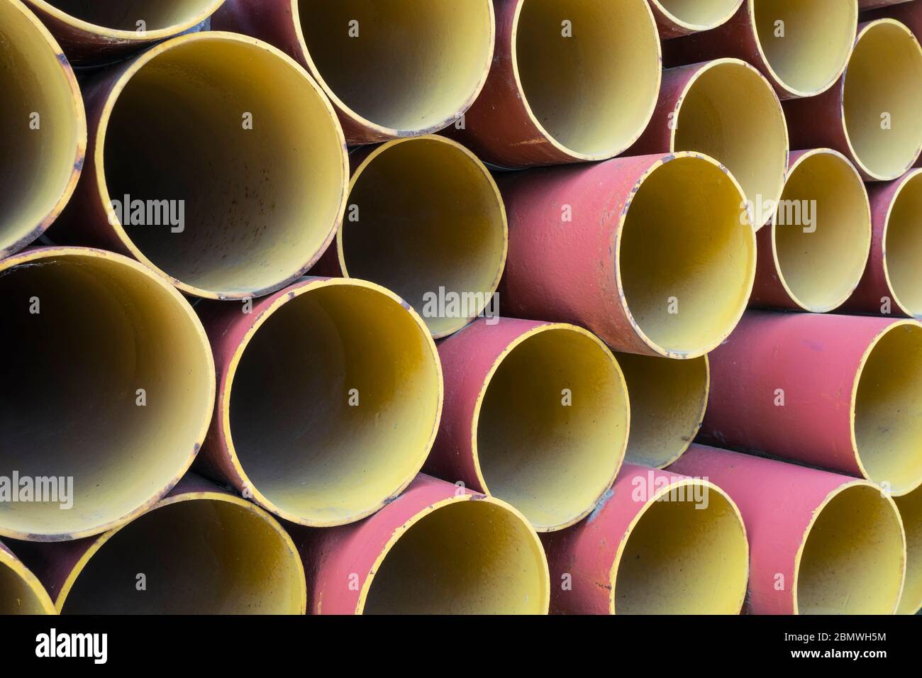 Stack of pipes on a construction site Stock Photo - Alamy