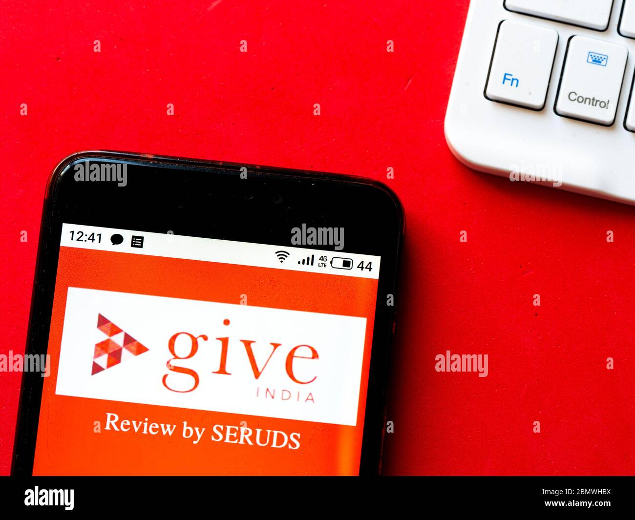 In this photo illustration a GiveIndia logo seen displayed on a ...