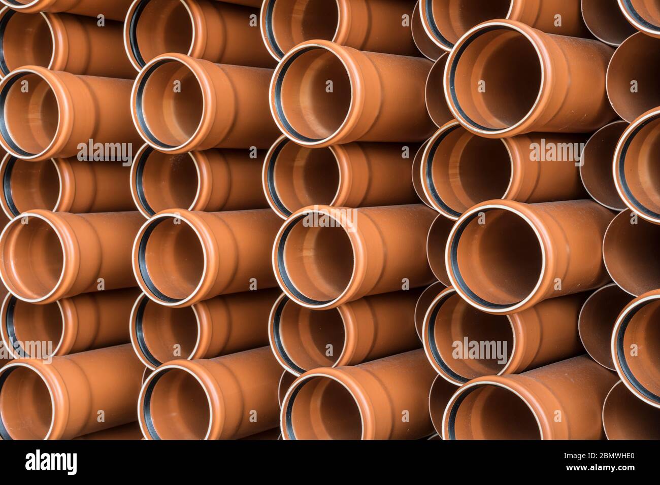 Stack of pipes on a construction site Stock Photo - Alamy