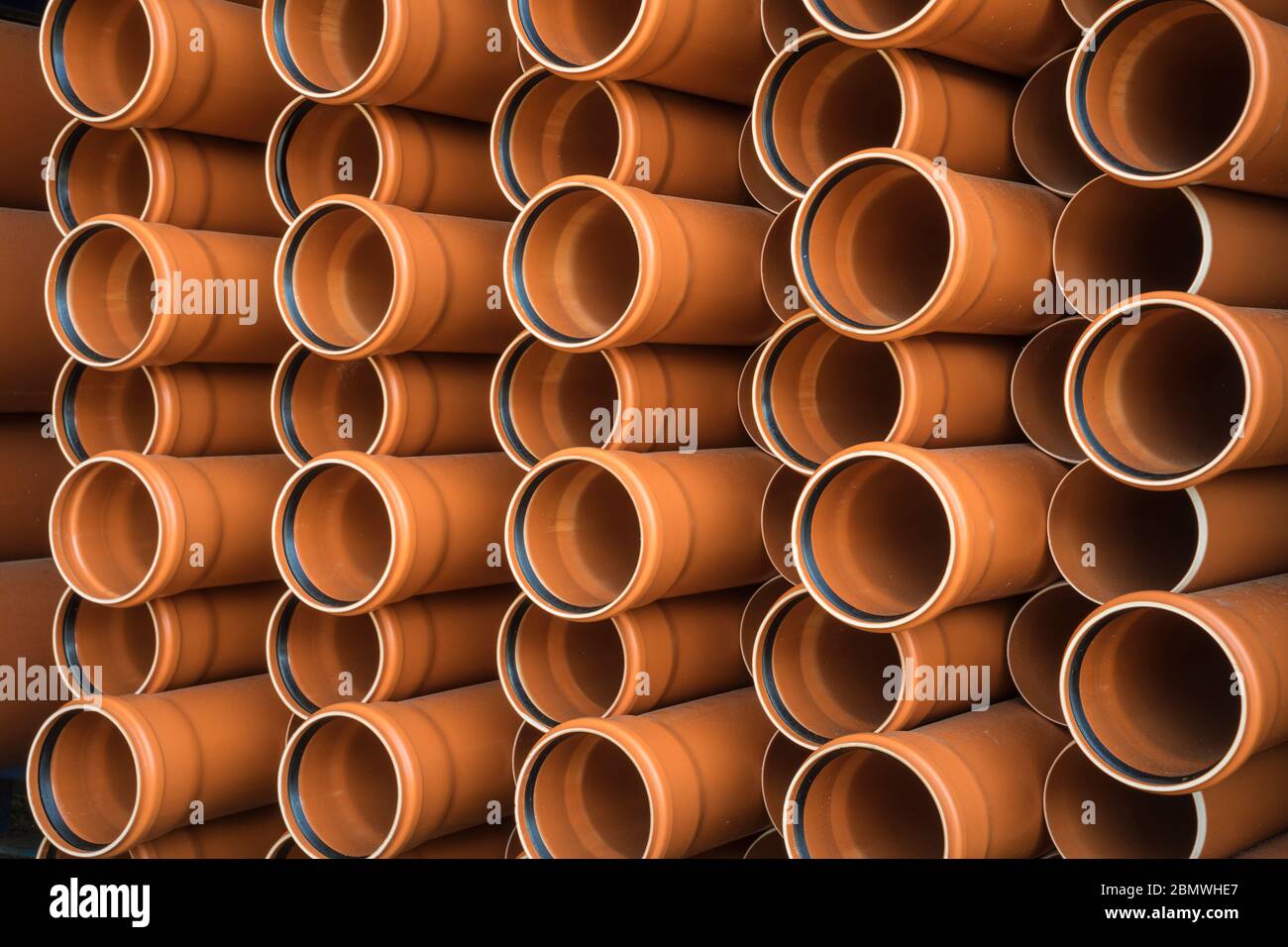 Stack of pipes on a construction site Stock Photo - Alamy