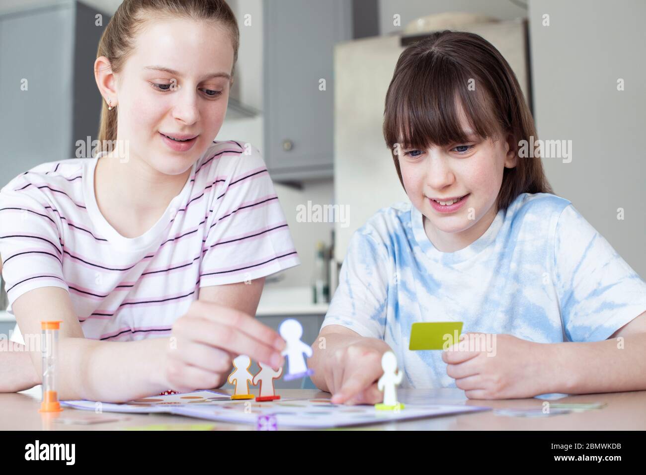 Two Children Playing Generic Board Game At Home Together Stock Photo ...