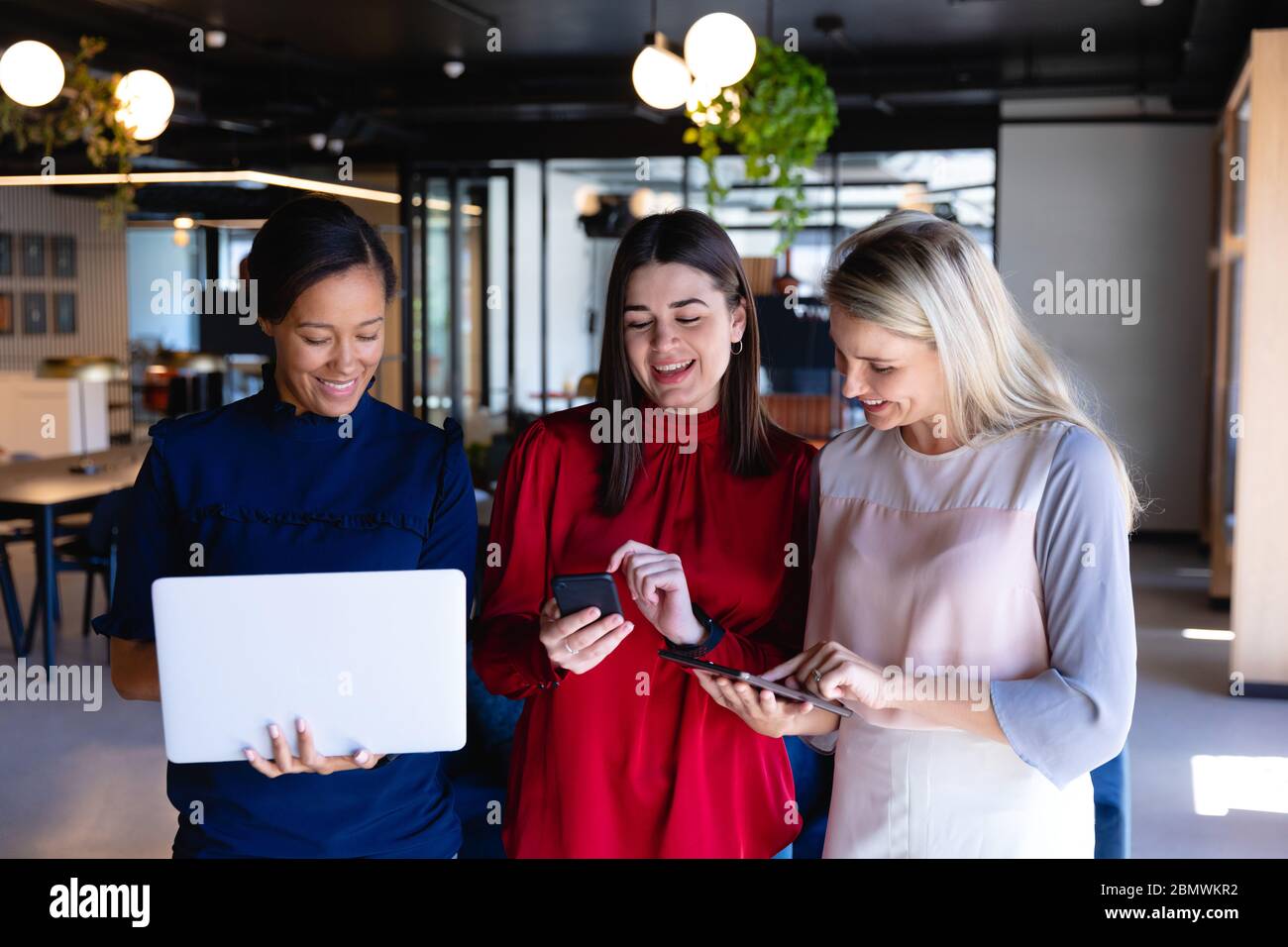 Business women using digital technology Stock Photo - Alamy