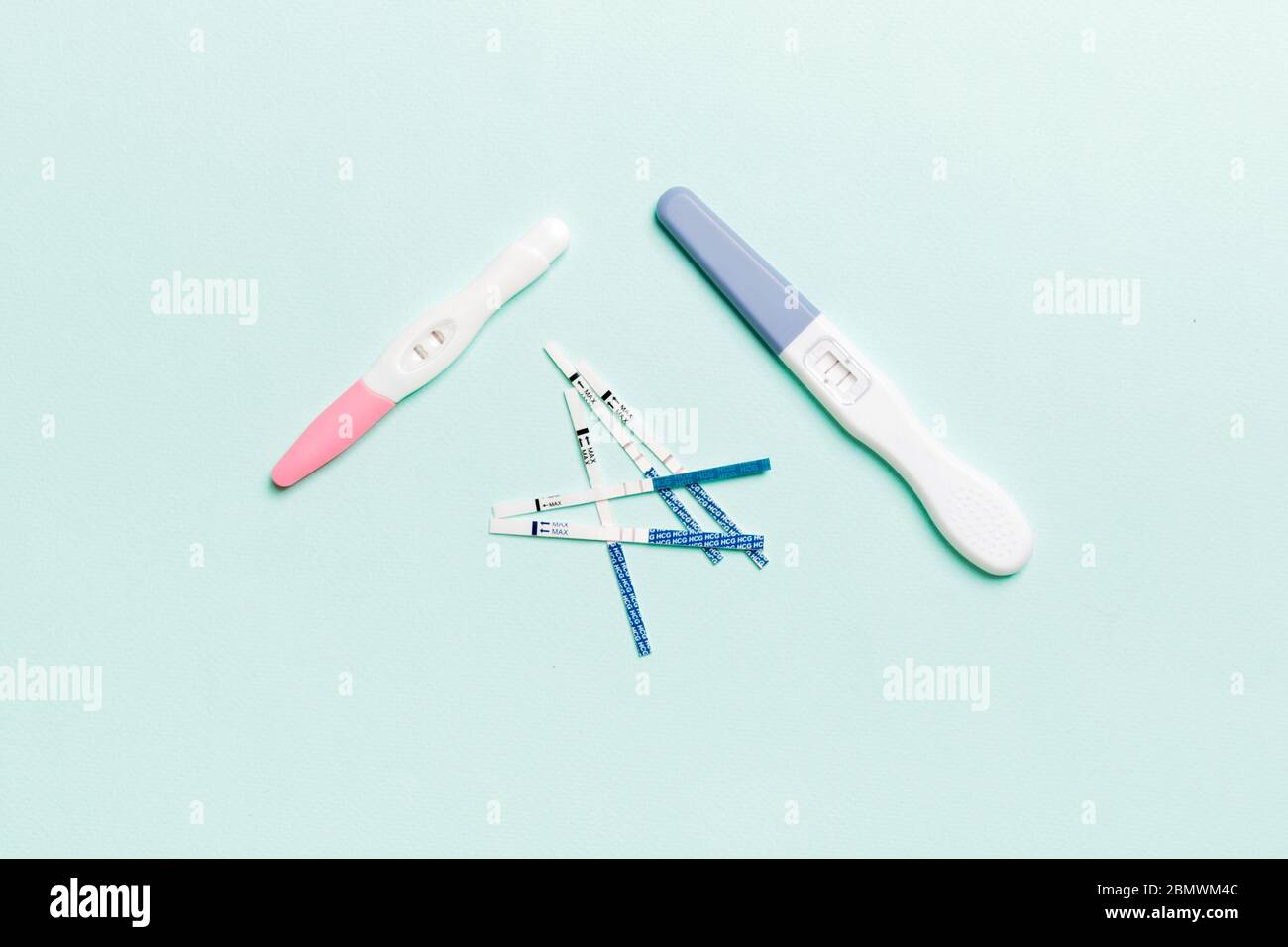 Colored Pregnancy test on colored background, top view with copy space ...