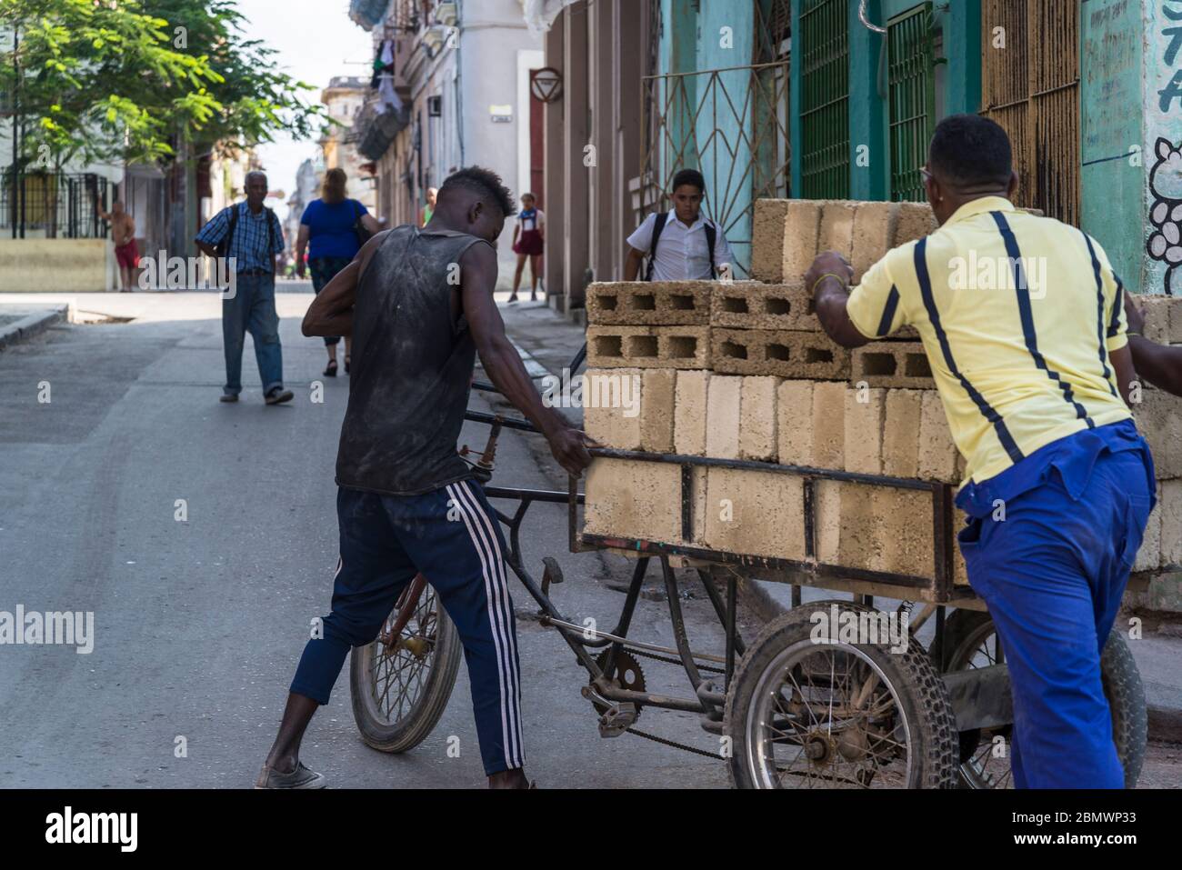Pushing a heavy load hi-res stock photography and images - Alamy