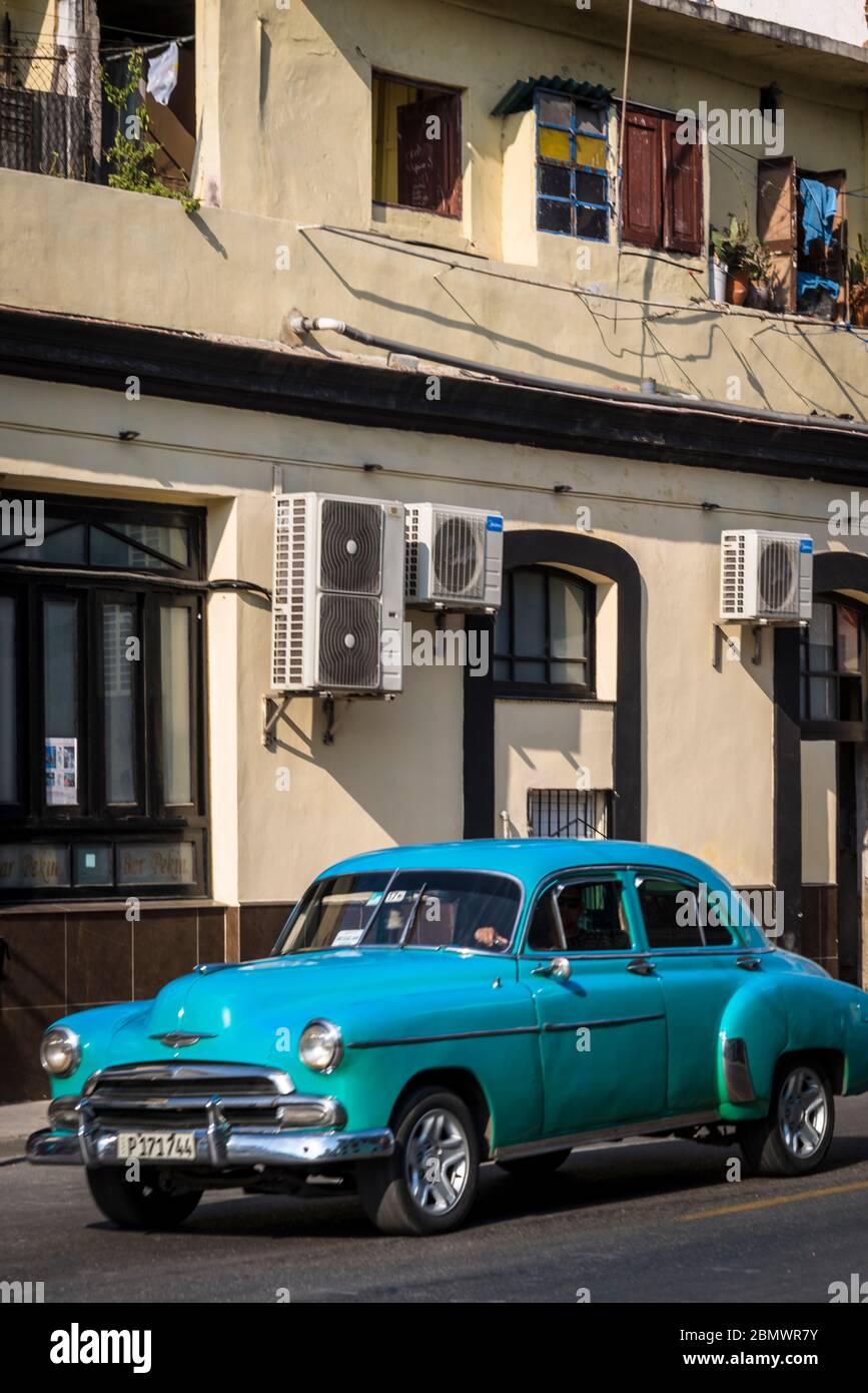 Vintage car driving in Havana Centro district, Havana, Cuba Stock Photo ...