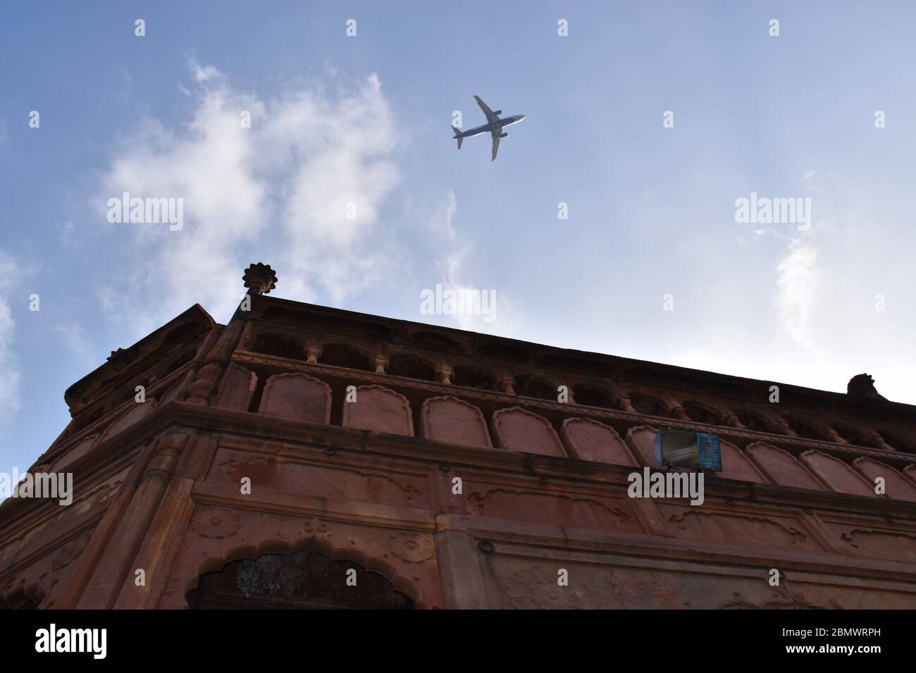 Jet plane aircraft travelling in the sky over city building in Bhopal ...
