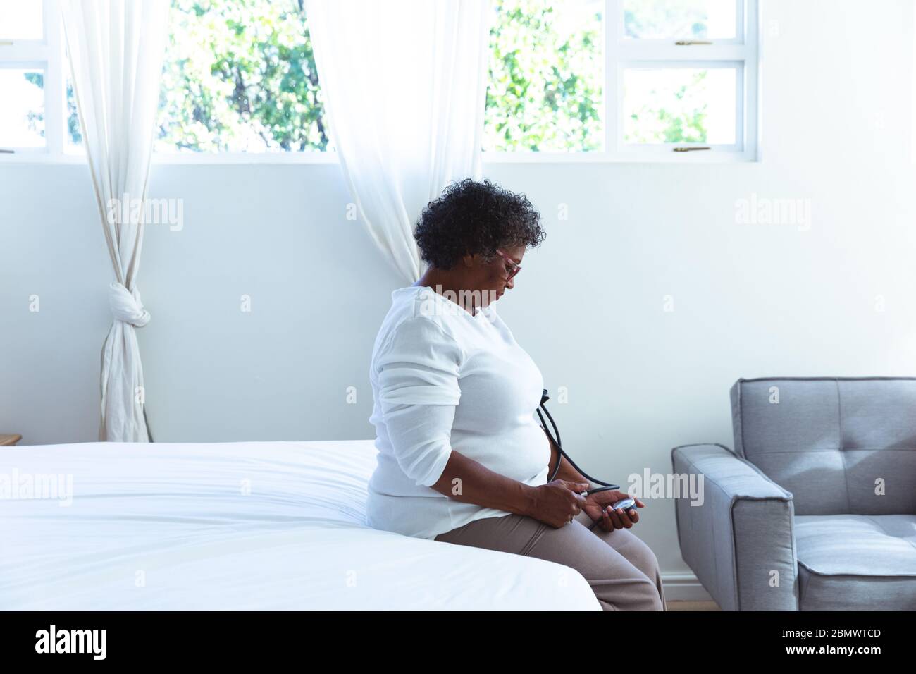 Senior African American woman at home during quarantine lock down for ...