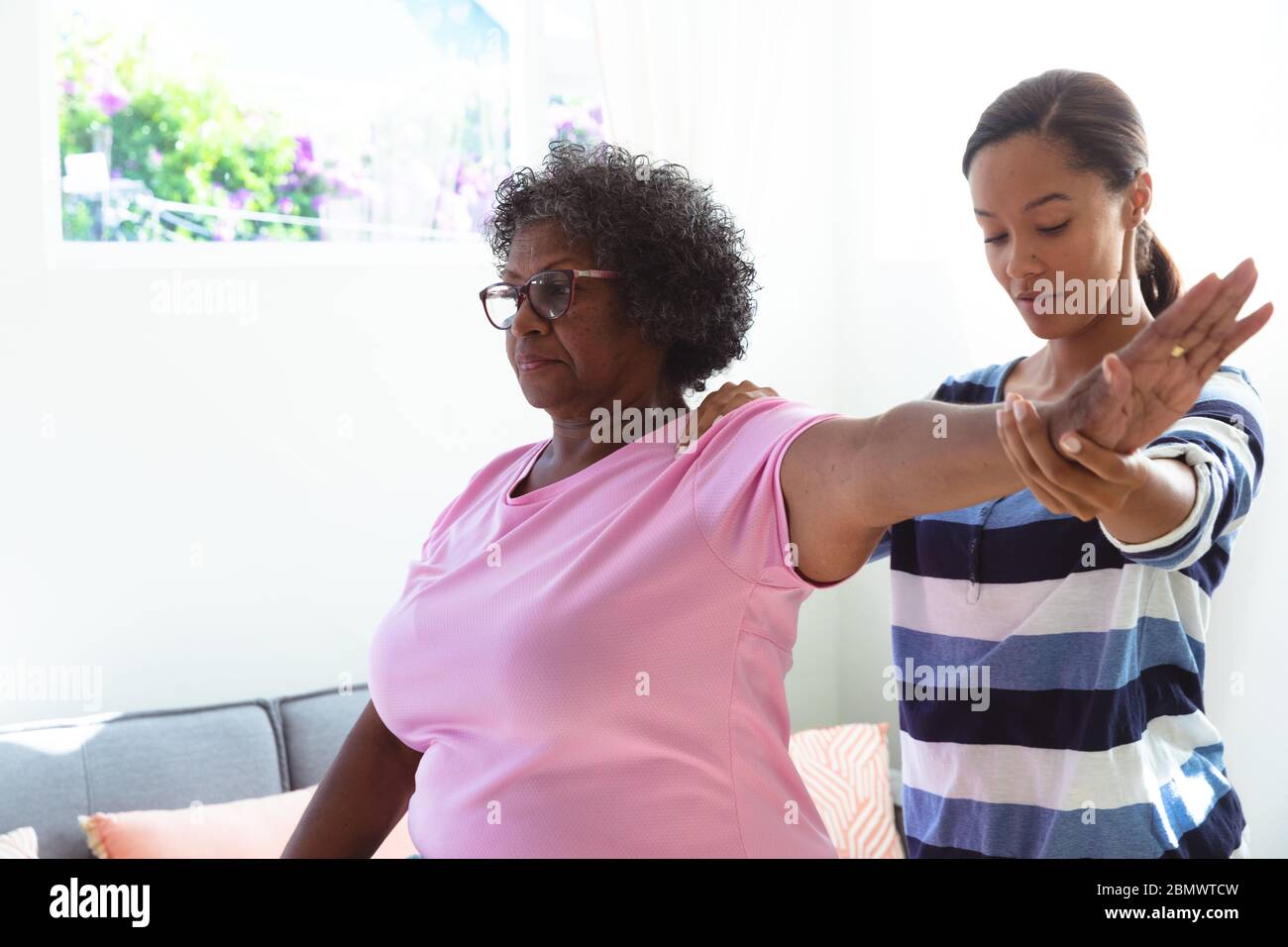 Senior African American woman at home during quarantine lock down for ...