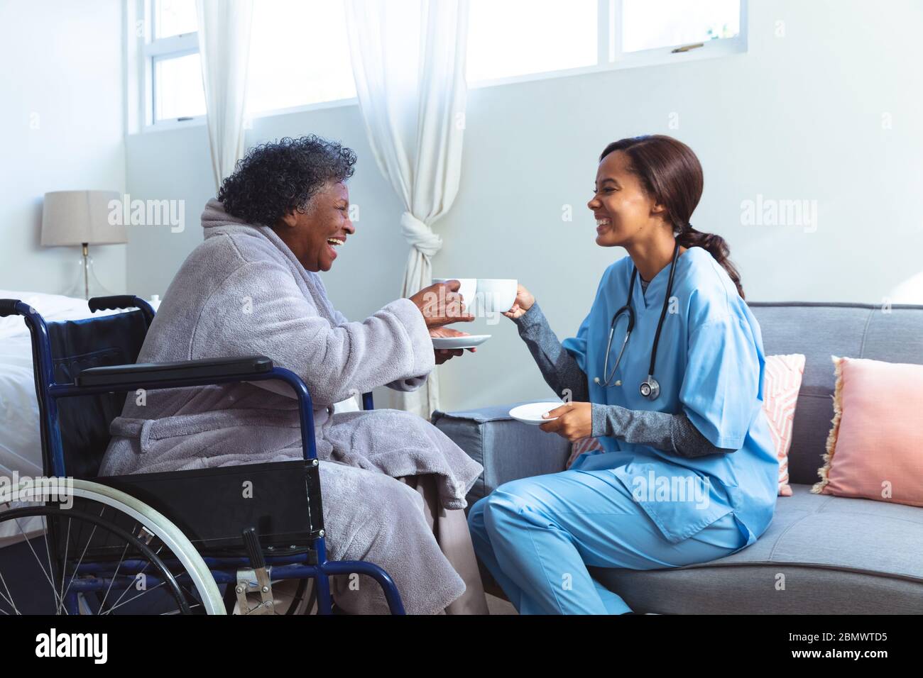 Sick senior African American woman at home during quarantine lock down ...