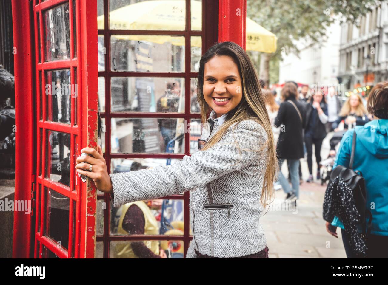 London telephone box girl hi-res stock photography and images - Alamy
