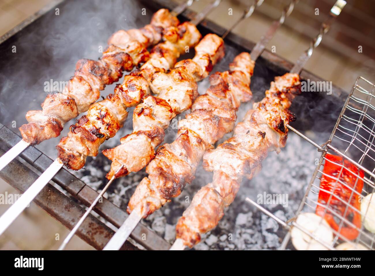 Bbq kebab grilling on open grill, outdoor kitchen. Food festival in ...