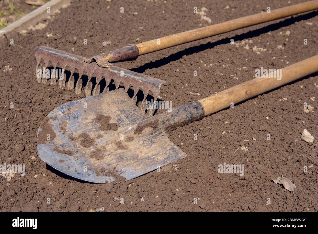 Hand shovel and rake. Garden tools before spring plantings. Hand Tools ...