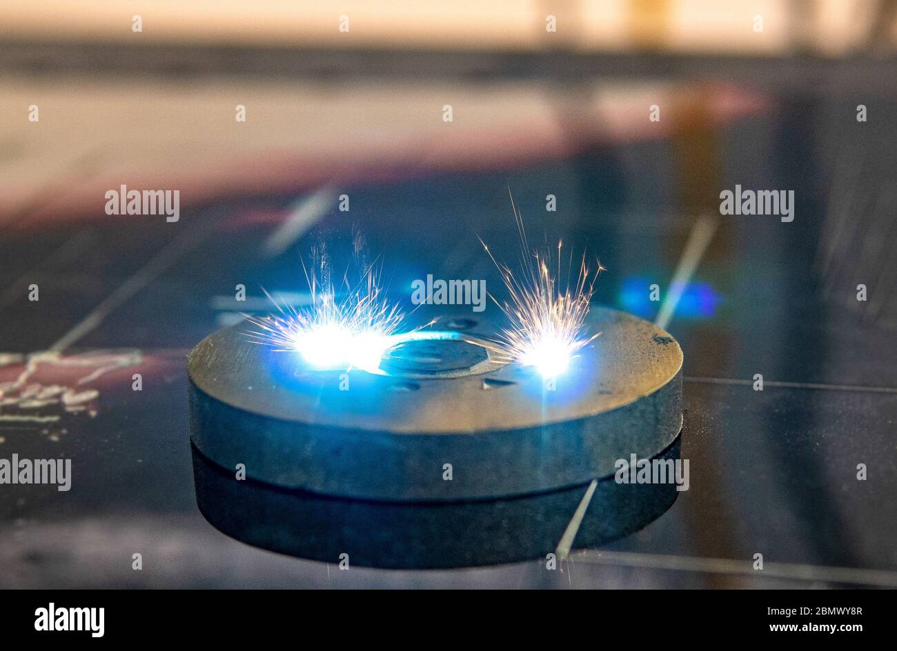 Evident action of the laser at engraving of a souvenir overlay Stock ...