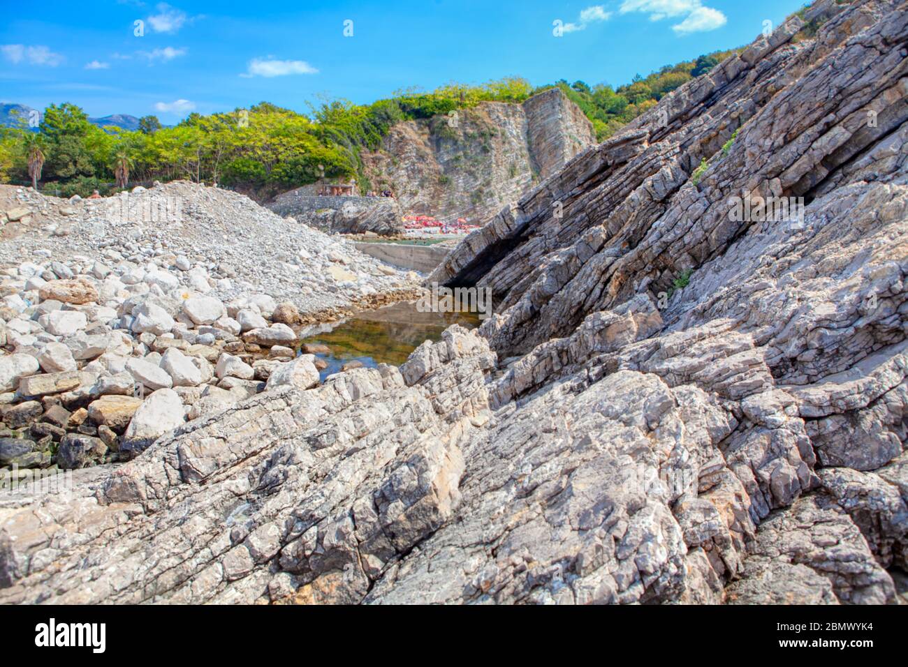coastal rocky foundation and exotic tropical beach Stock Photo - Alamy