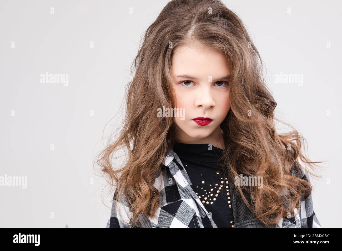 Cute baby girl rock star playing electric guitar and singing song ...