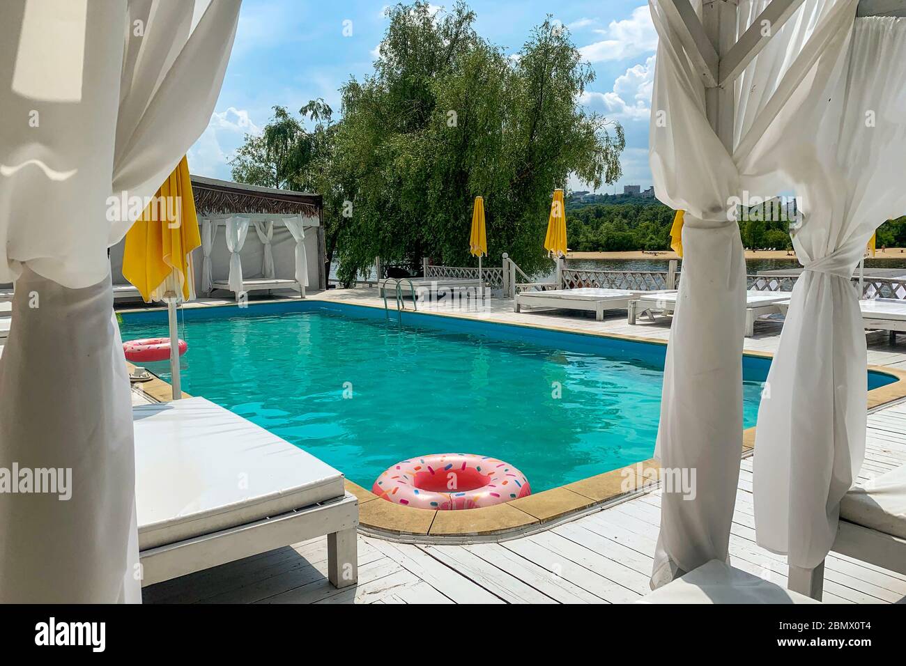 Beautiful luxury outdoor swimming pool with sun beds in hotel for ...