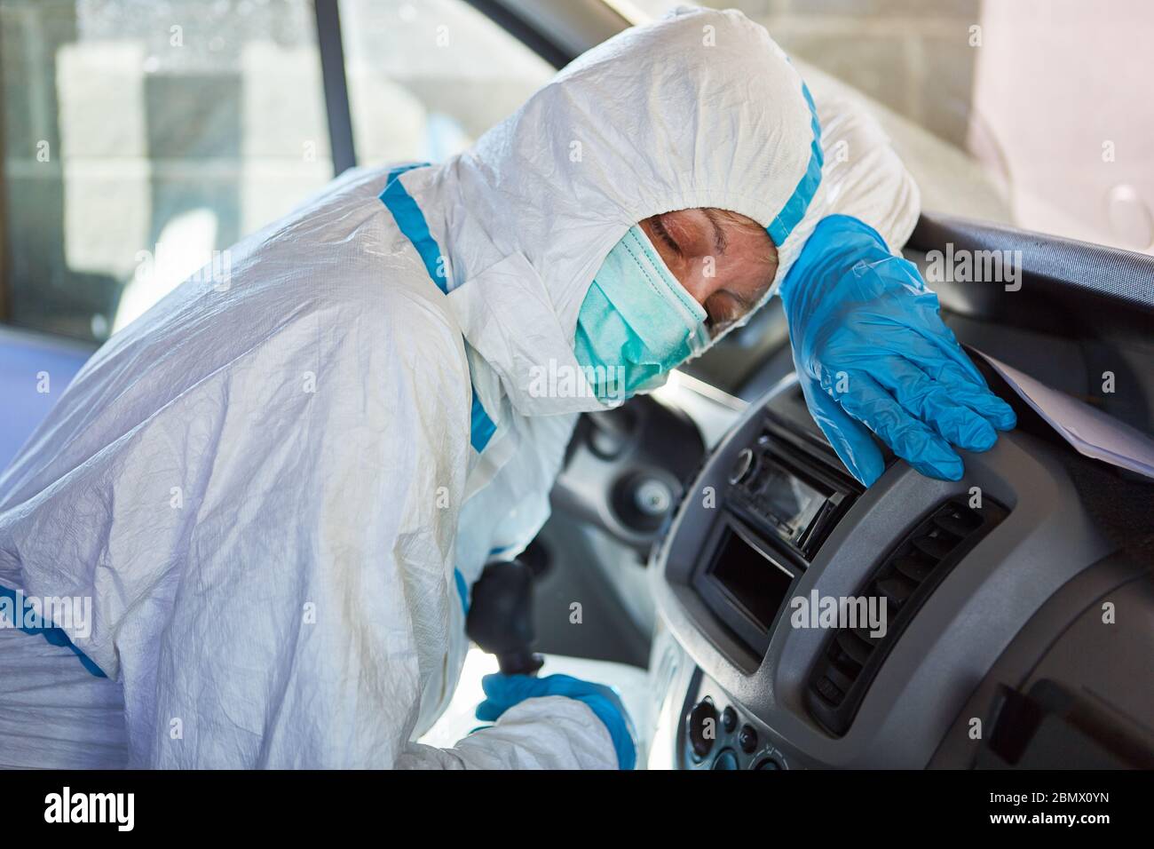 Tired emergency doctor from the ambulance service sleeps in ambulance ...