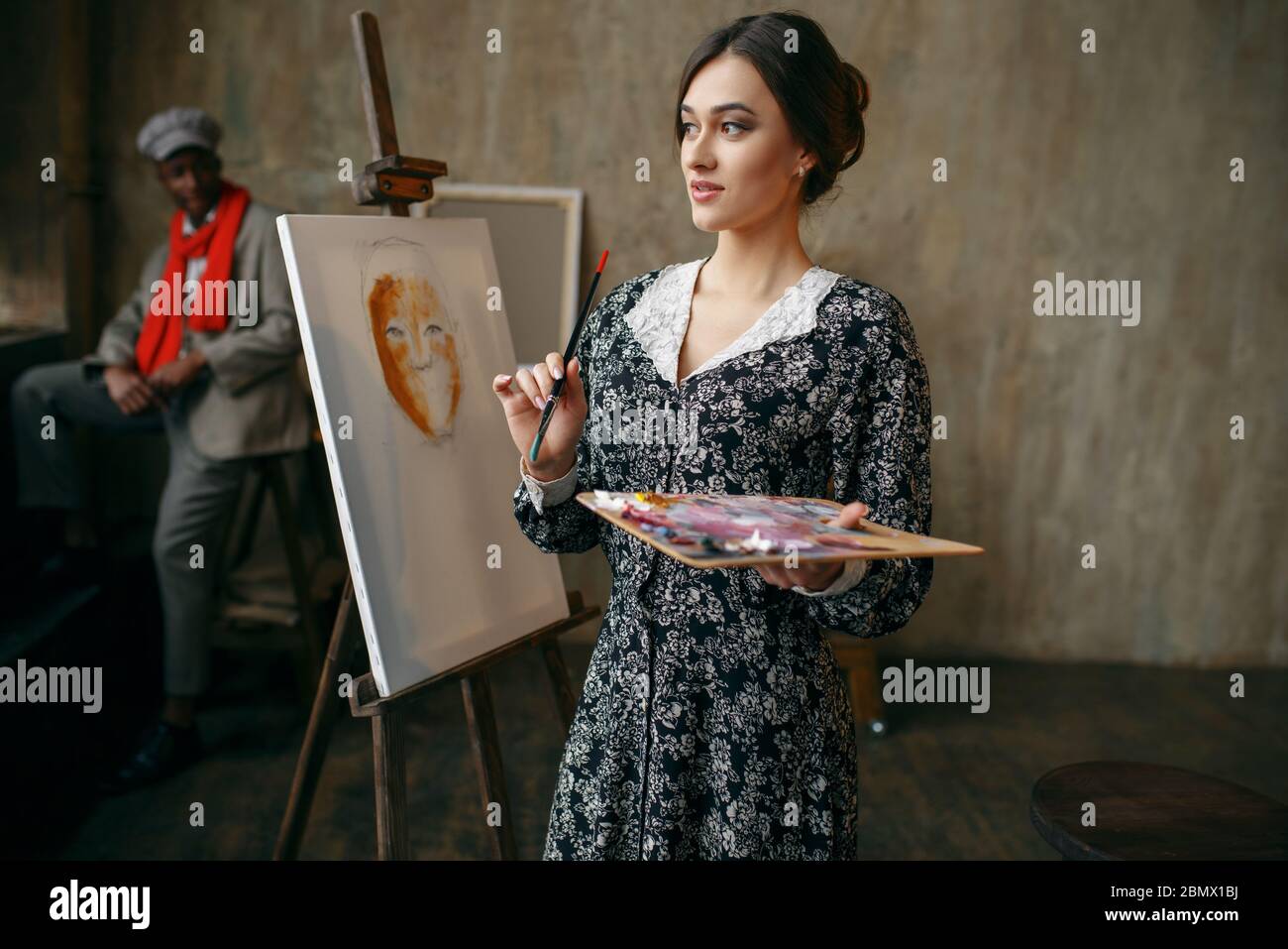 Female portrait painter and male model in studio Stock Photo - Alamy