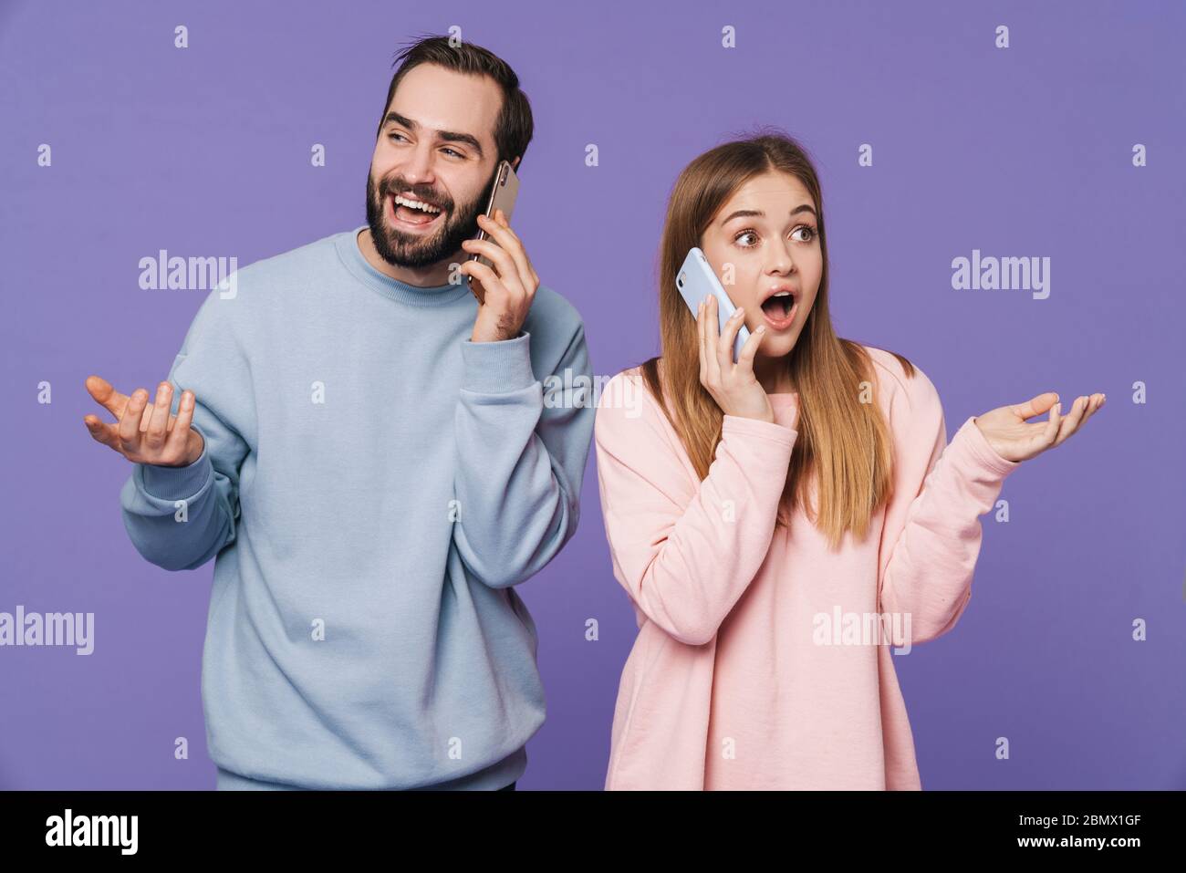 Picture of happy optimistic loving couple isolated over purple ...