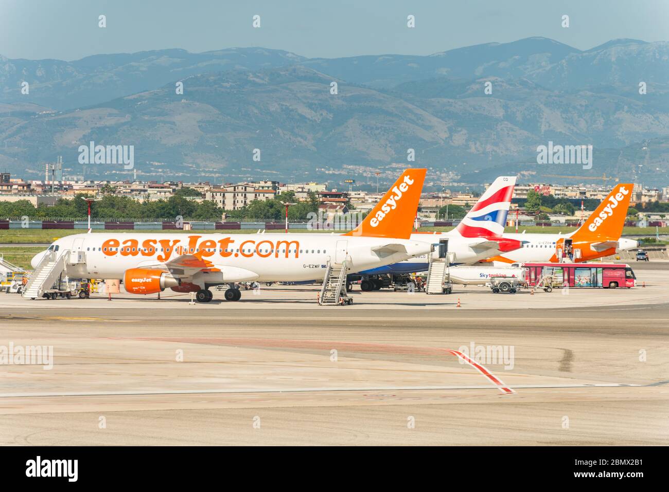 Aircrafts of the EasyJet stopped at the apron of Naples international ...