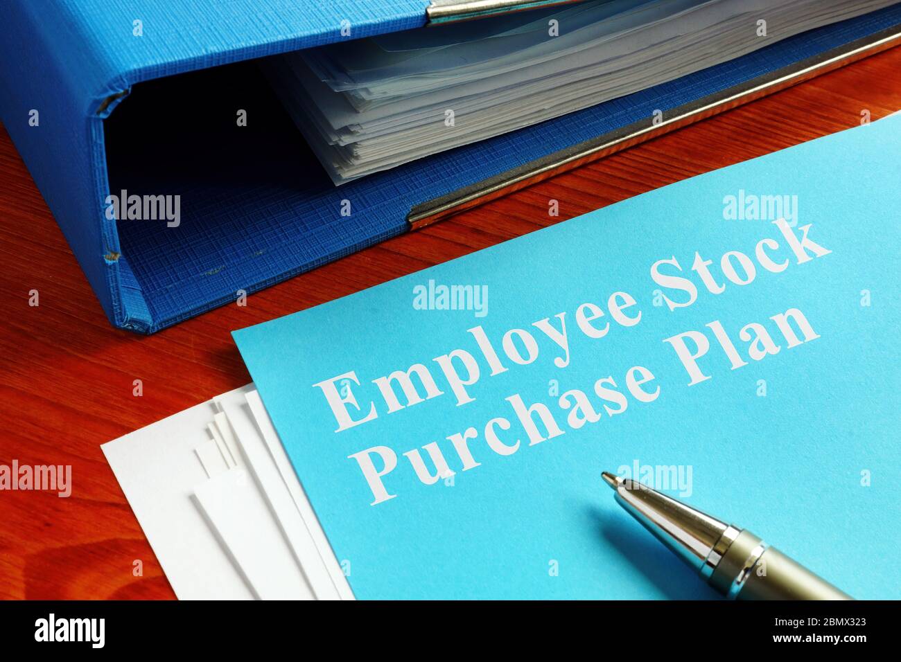 Employee Stock Purchase Plan ESPP and blue folder Stock Photo - Alamy