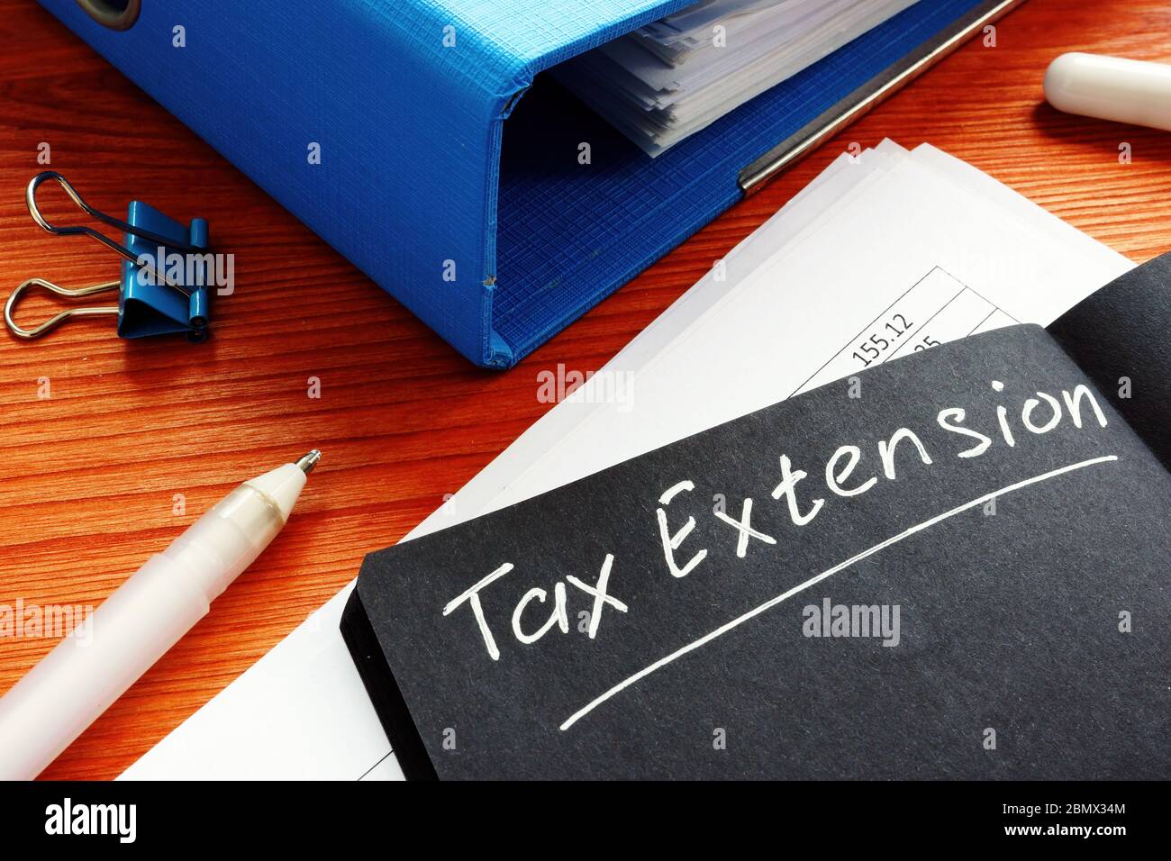 Tax Extension sign on the black sheet Stock Photo - Alamy