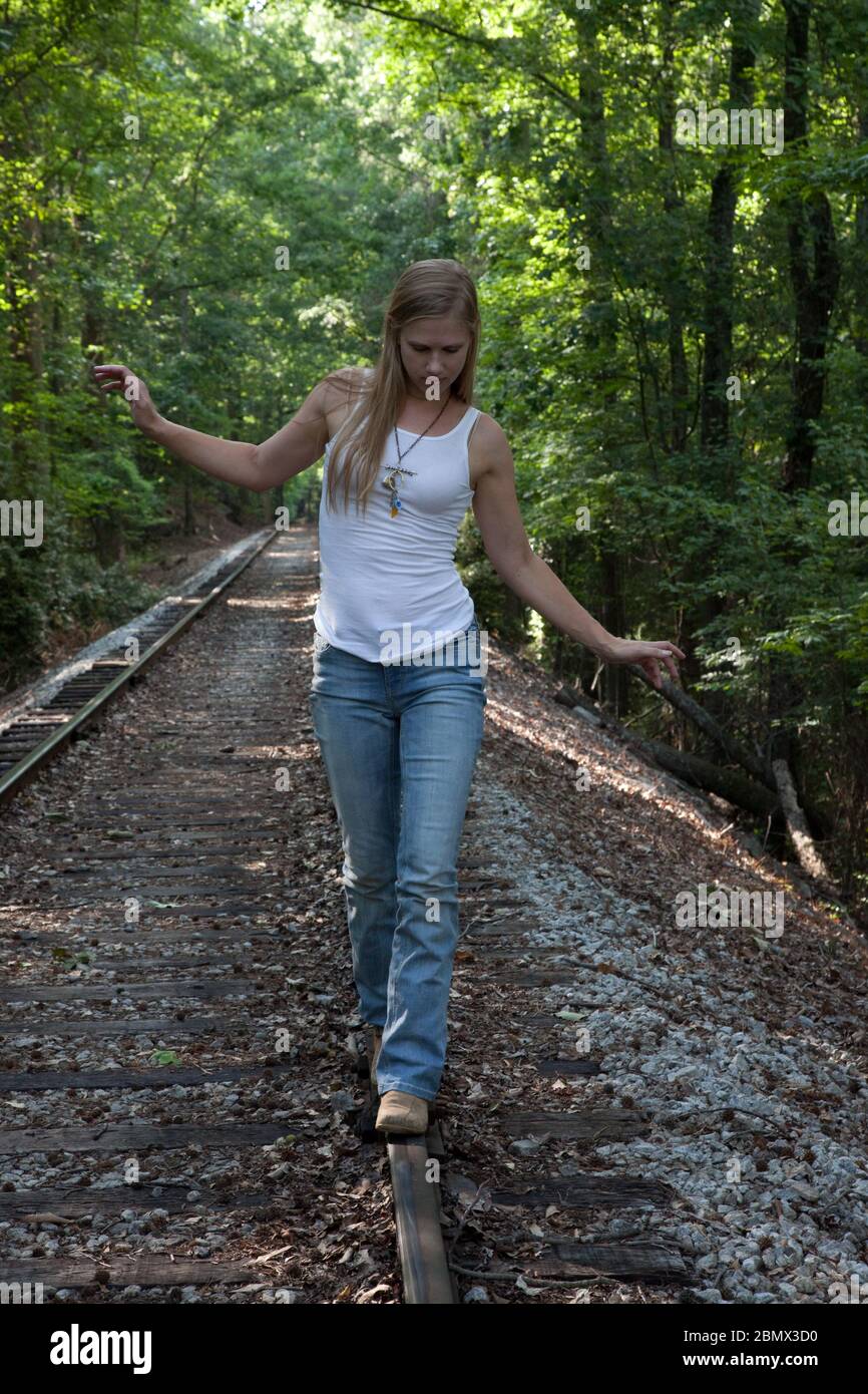 Lovely Blond woman on railroad tracks Stock Photo - Alamy