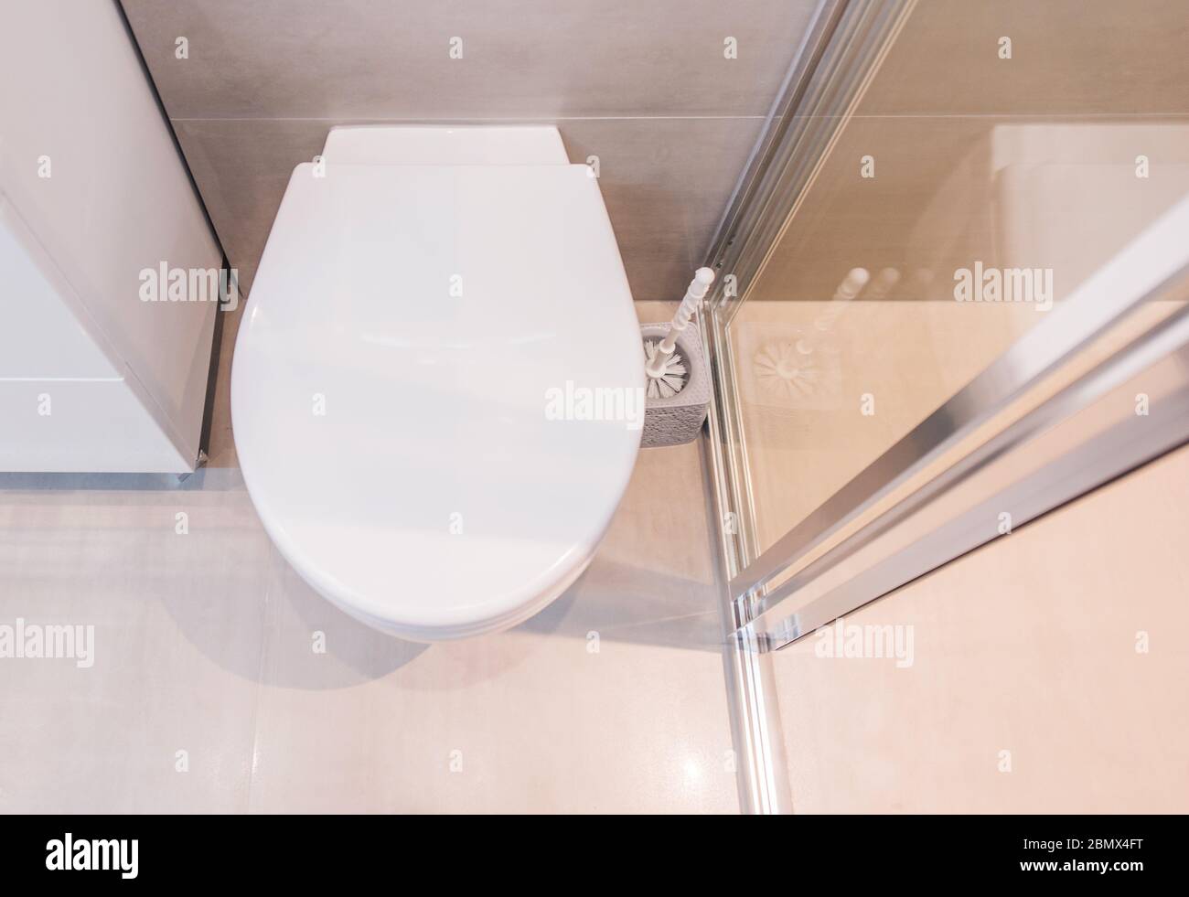 Top View Of Restroom Cabin With White Toilet And Glass Wall Stock Photo ...