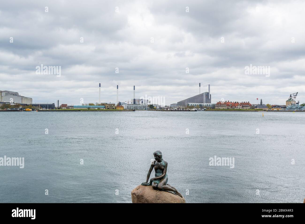 The Little Mermaid statue by Edvard Eriksen, displayed on a rock by the waterside at the ...