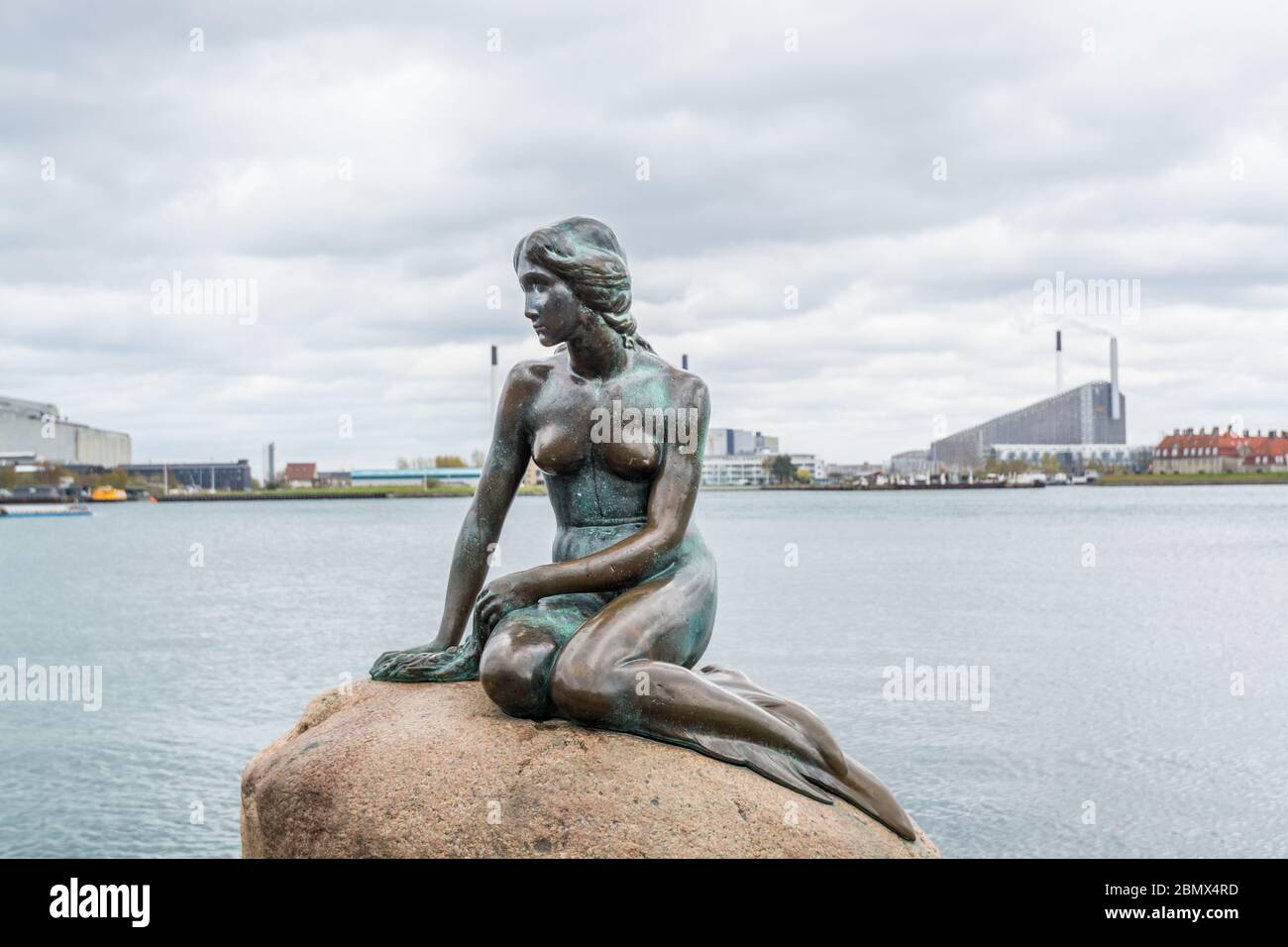 The Little Mermaid statue by Edvard Eriksen, displayed on a rock by the waterside at the ...