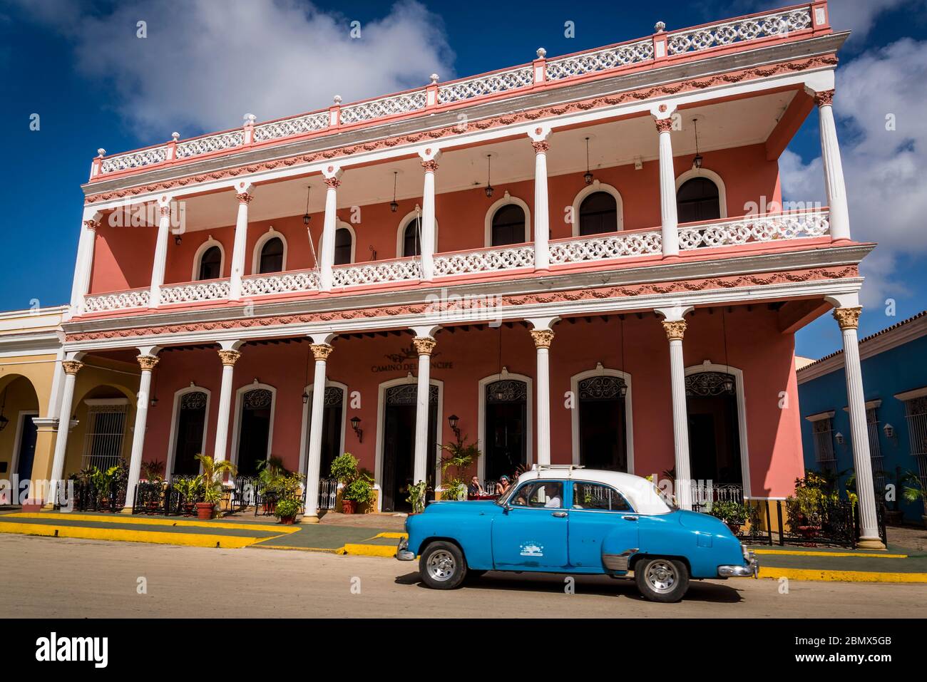 Classic car passing by Colonial era Hotel Camino del Príncipe at the ...