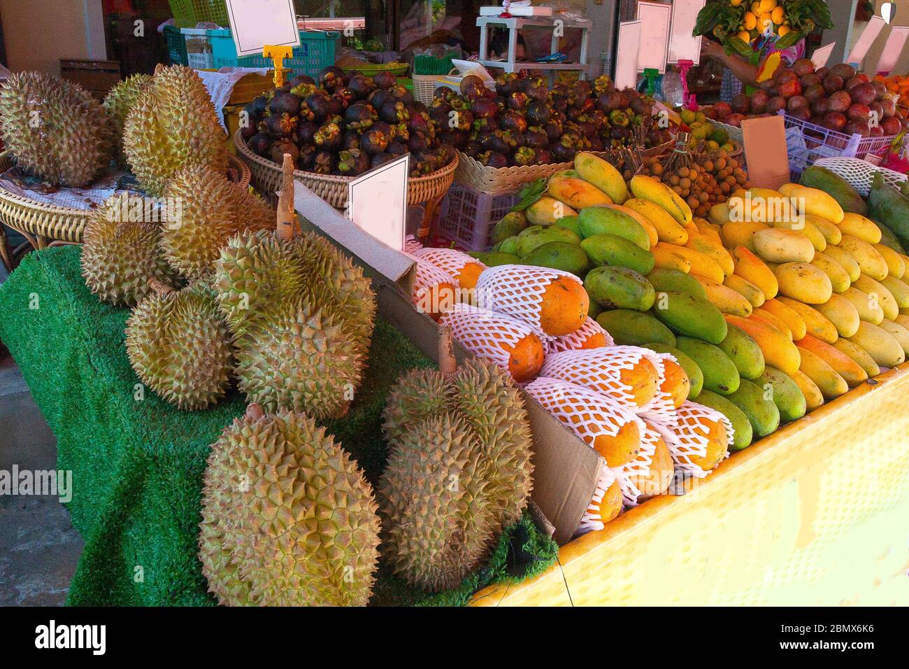 Durian, rambutan, mangosteen, longan fruits are sold at a bazaar in ...