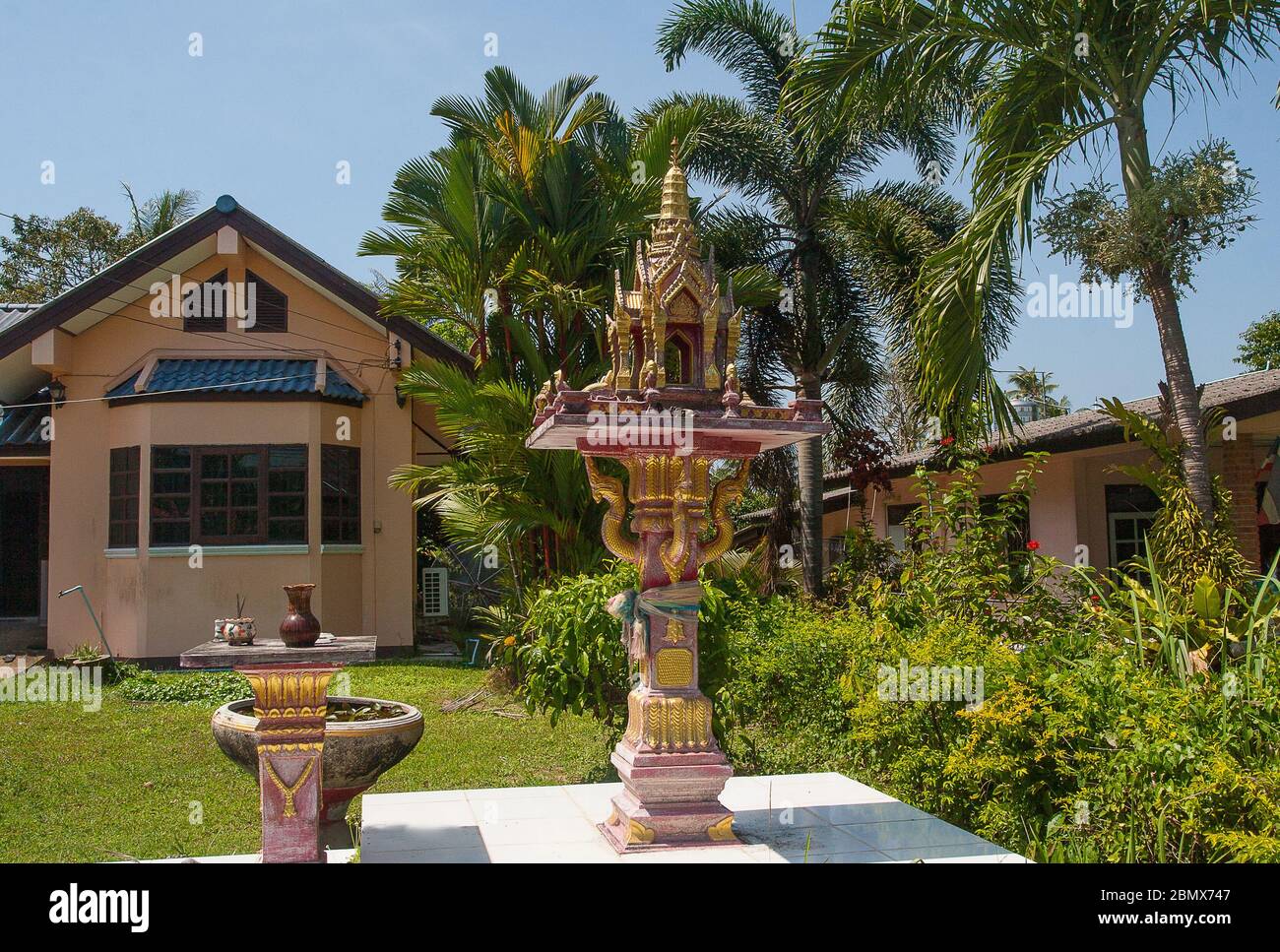 A beautiful spiritual house with decorations and incense bowls is ...