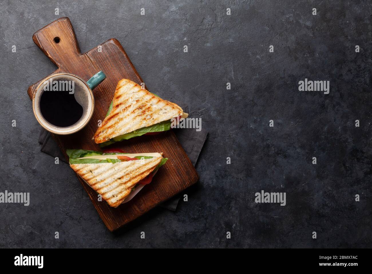 Coffee cup and club sandwich. Breakfast meal. Top view with copy space ...