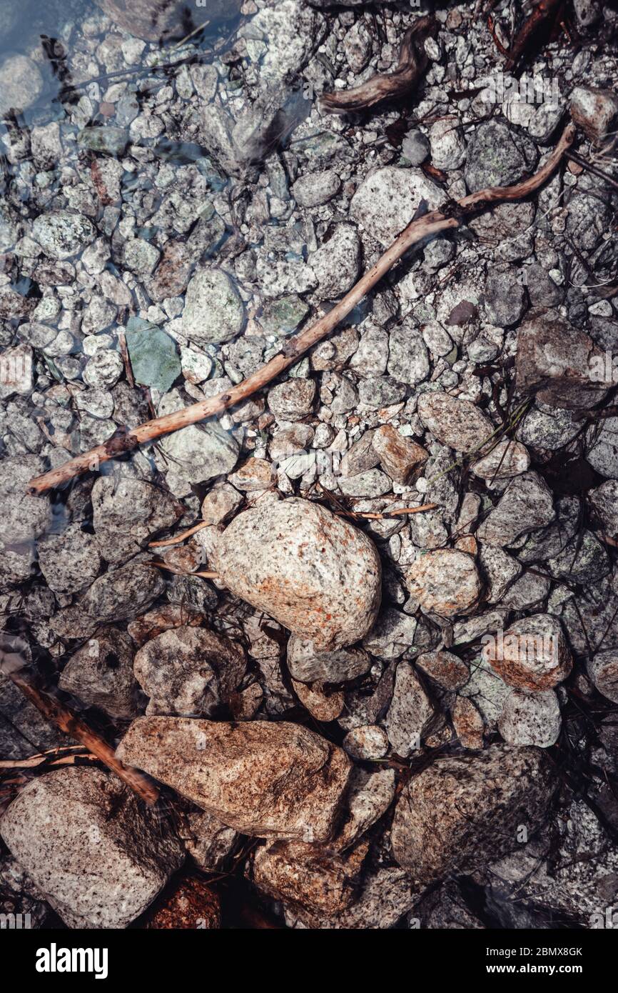 River pebbles under water. Abstract background of pebbles lying on the ...