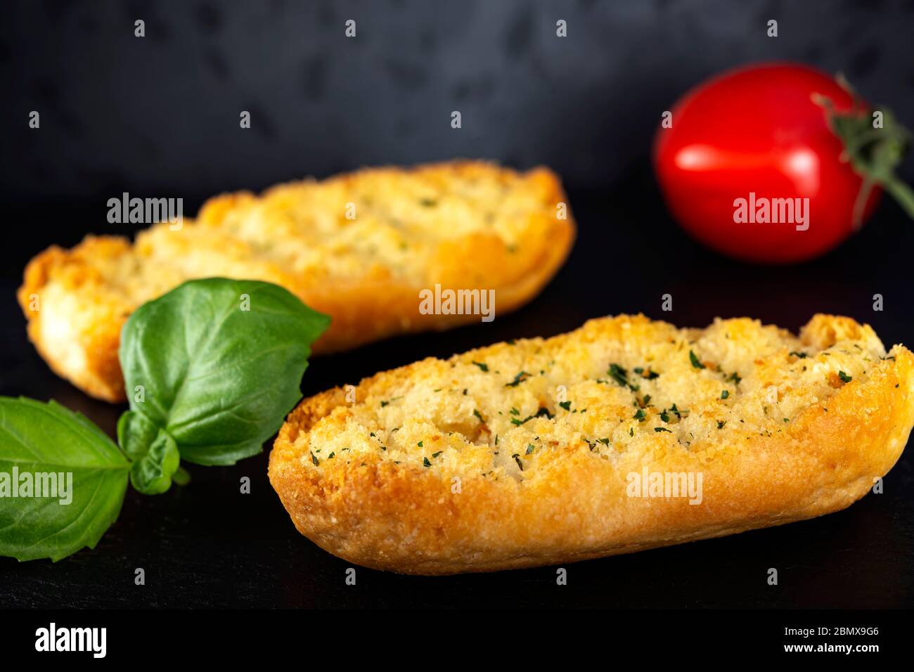 Fried bread with olive oil and herbs on a dark slate Stock Photo - Alamy