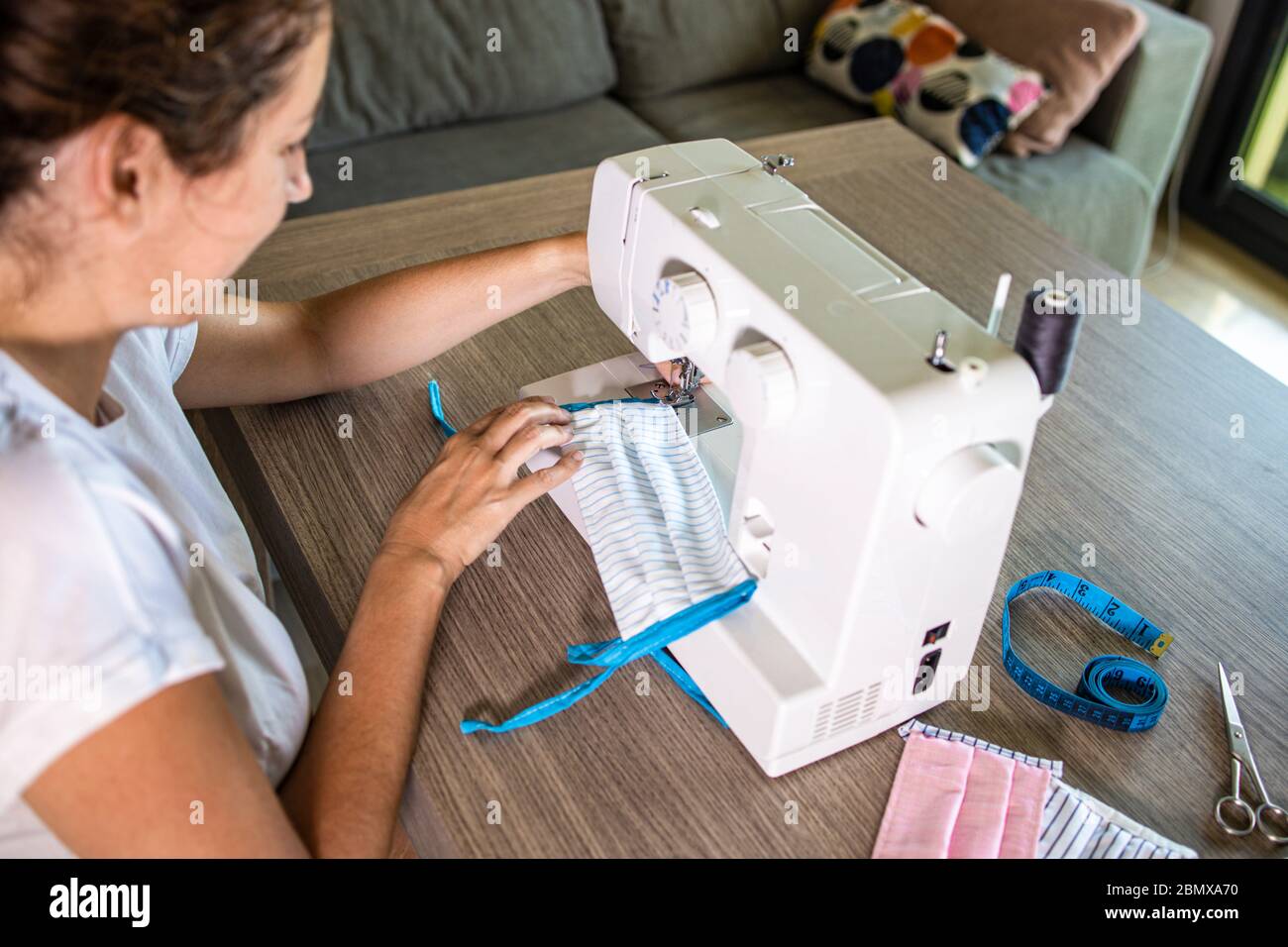 Woman making face masks hi-res stock photography and images - Alamy