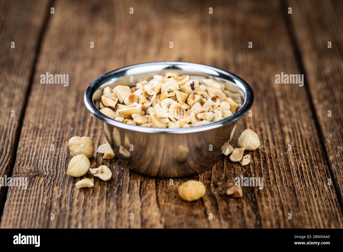Freshly chopped Hazelnuts as detailed close up shot (selective focus ...
