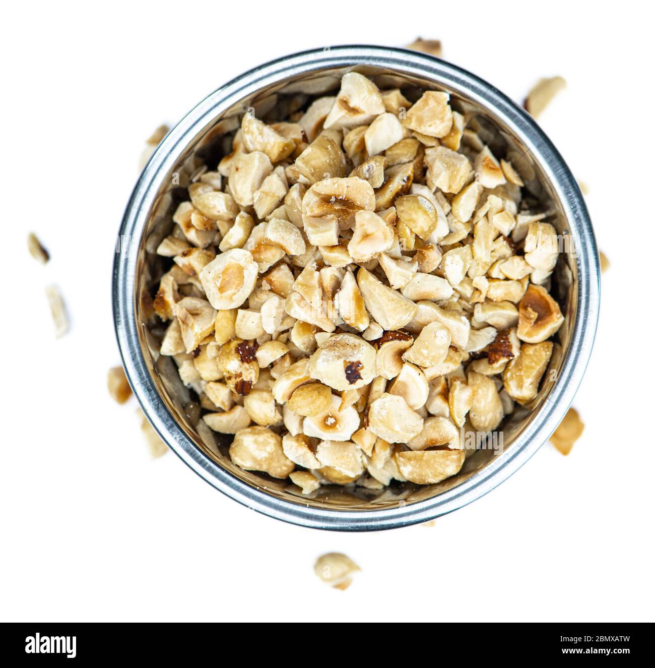Freshly chopped Hazelnuts as detailed close up shot isolated on white ...