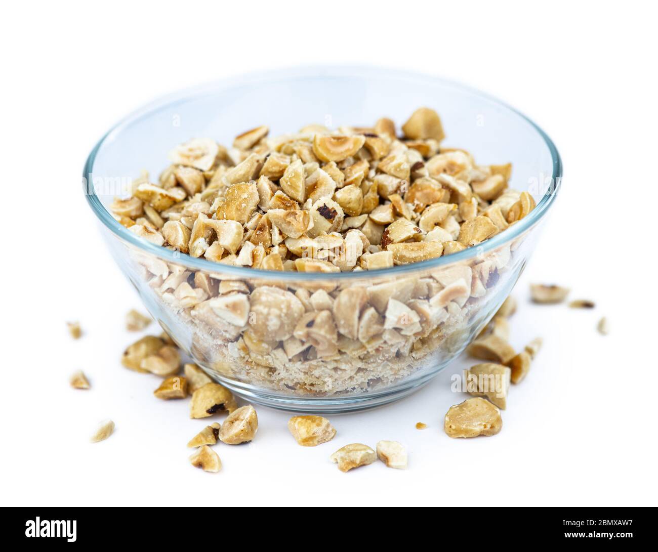 Freshly chopped Hazelnuts as detailed close up shot isolated on white ...