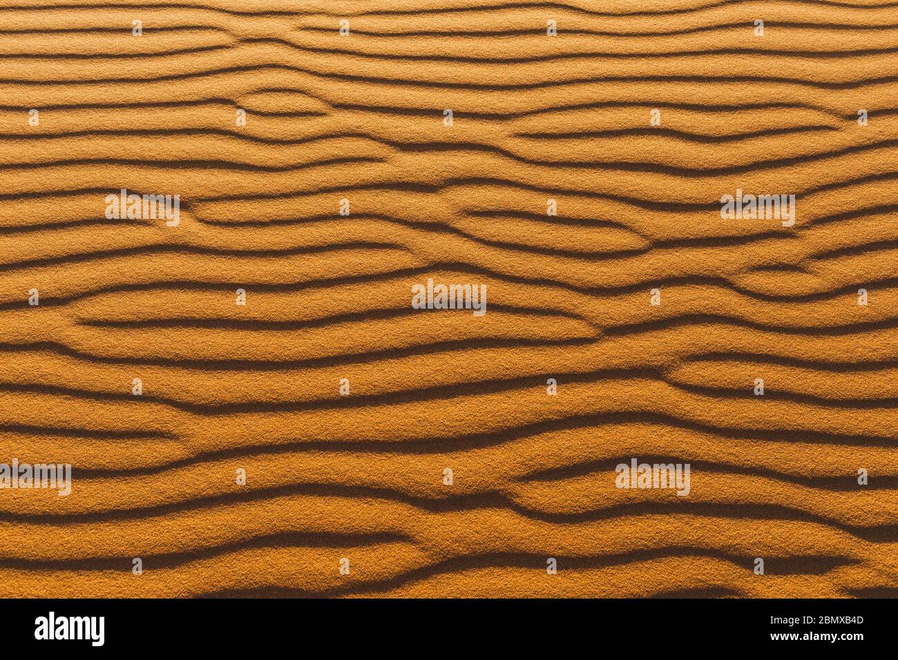 Orange texture of sand dune. Abstract shape, background, shadow and sun ...
