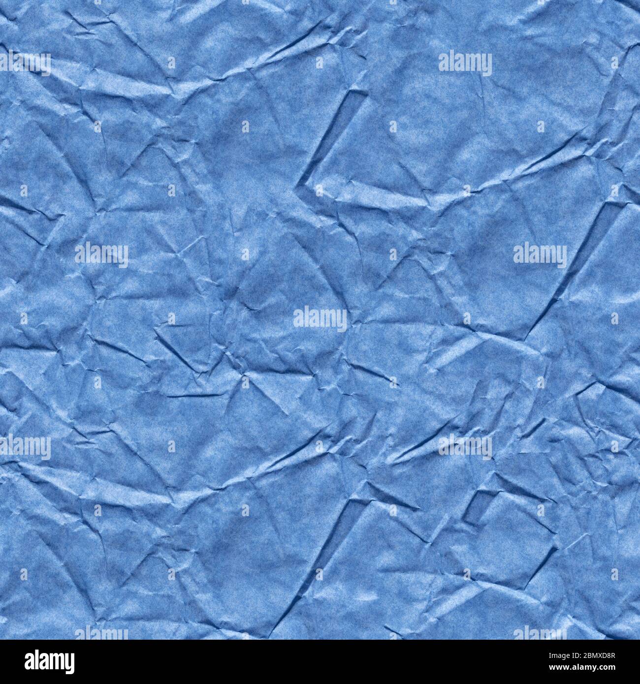 Crumpled paper background in saturated blue color for your awesome ...