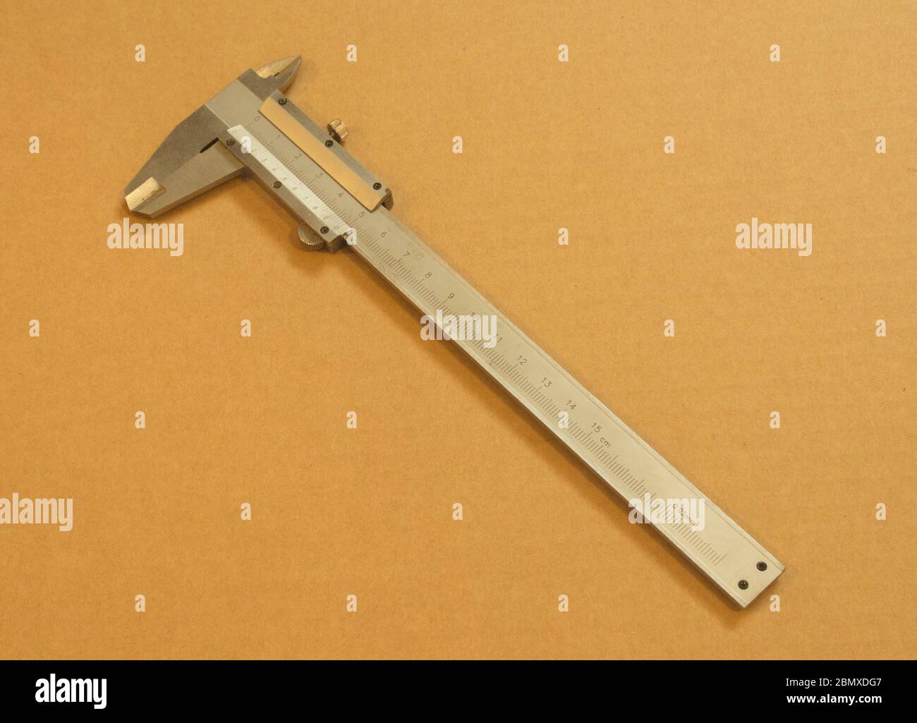 Slide gauge at a brown background Stock Photo - Alamy