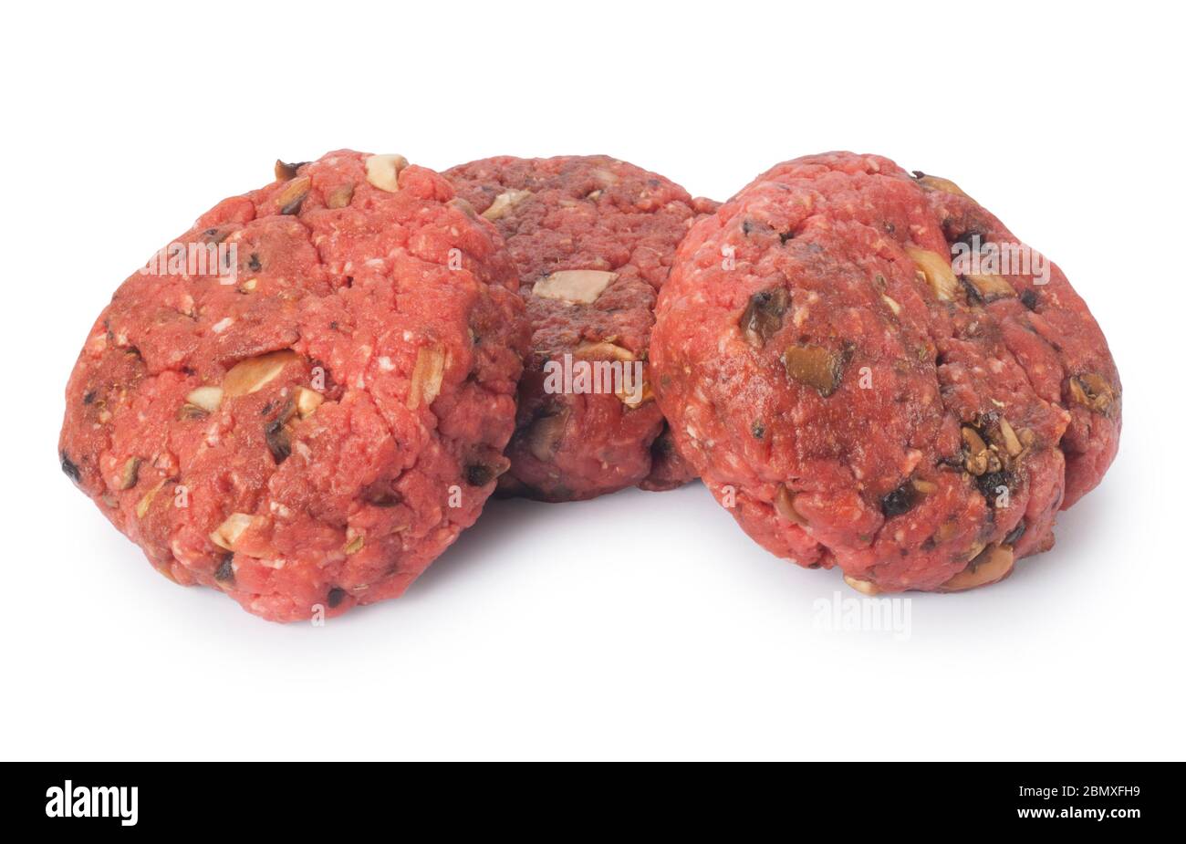 Studio shot of uncooked beef burger cut out against a white background ...