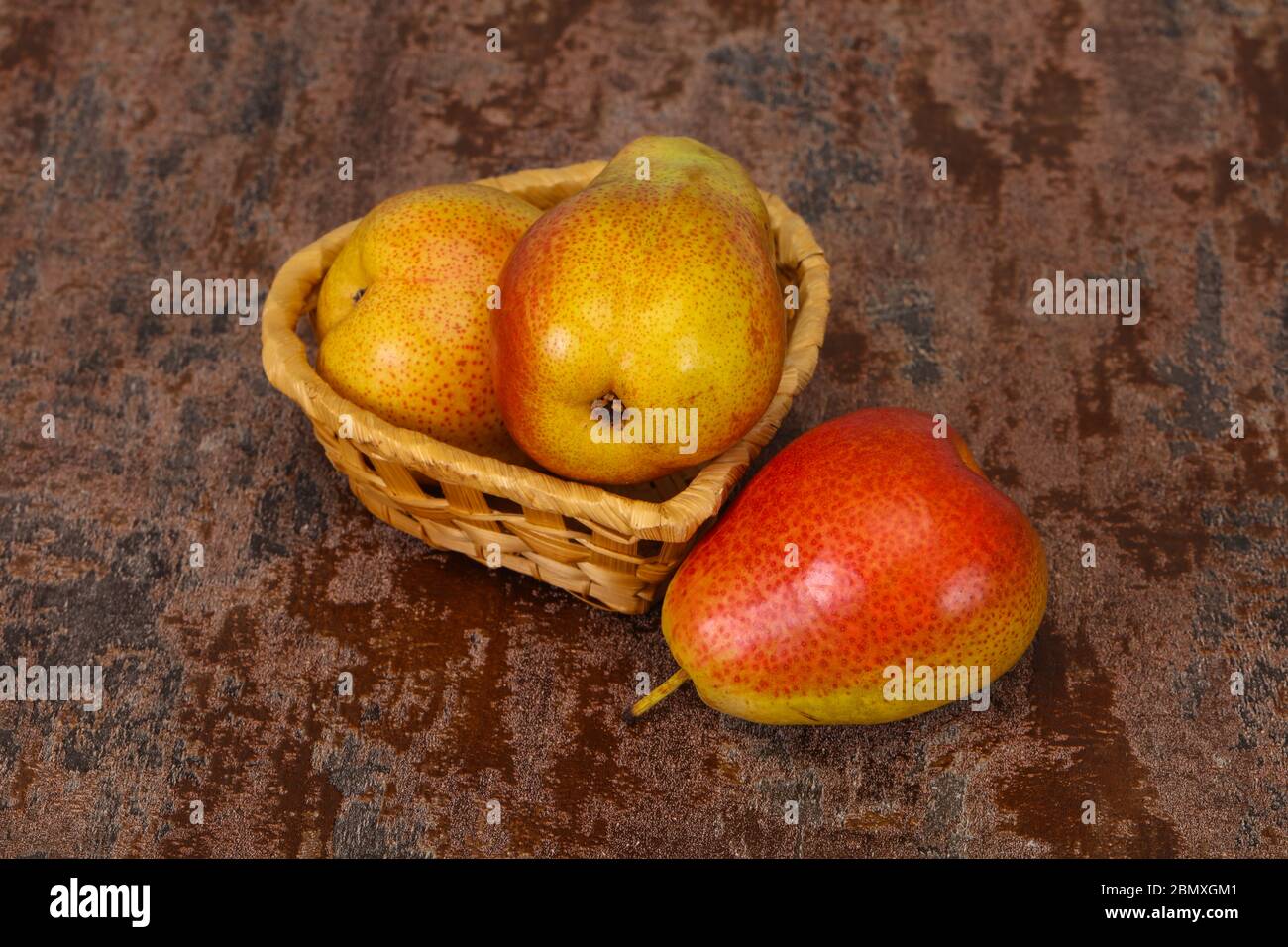 Ripe Pear heap in the wooden basket Stock Photo - Alamy
